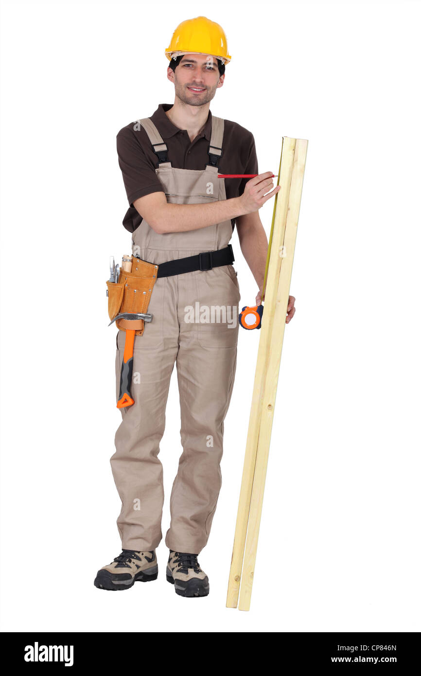 Man measuring wood Stock Photo - Alamy