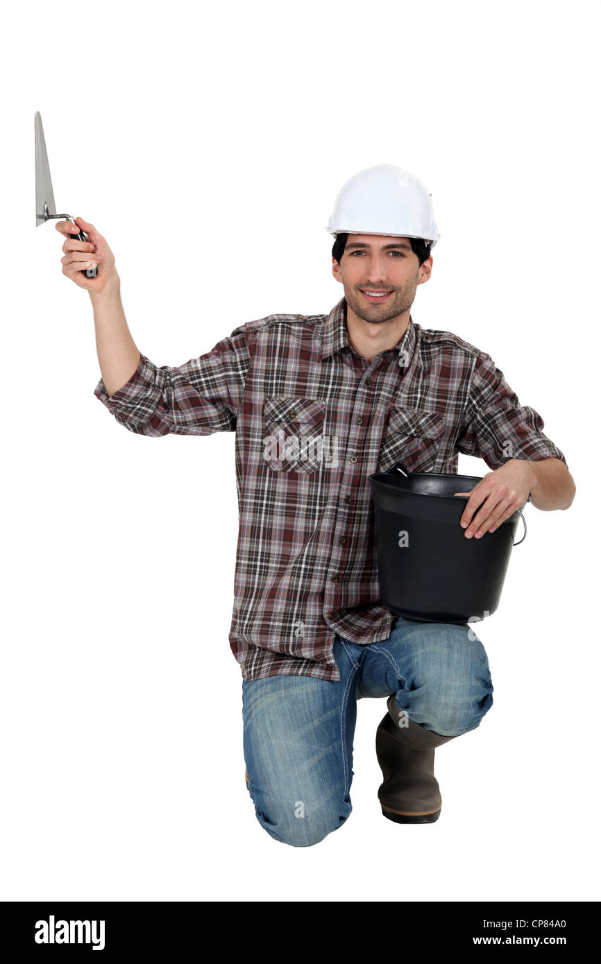 Builder with bucket and trowel Stock Photo - Alamy