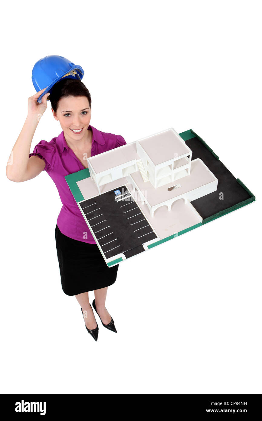 Female architect holding a scale model Stock Photo - Alamy