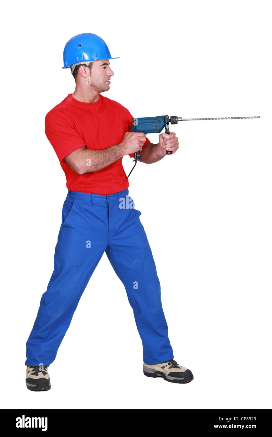 Man using large drill Stock Photo - Alamy