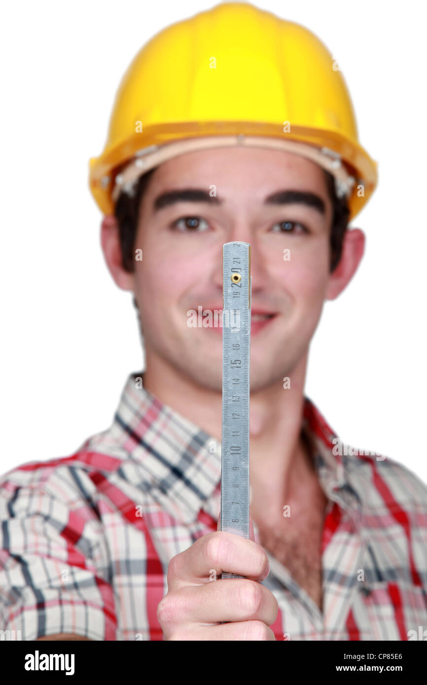 portrait of craftsman holding ruler Stock Photo - Alamy