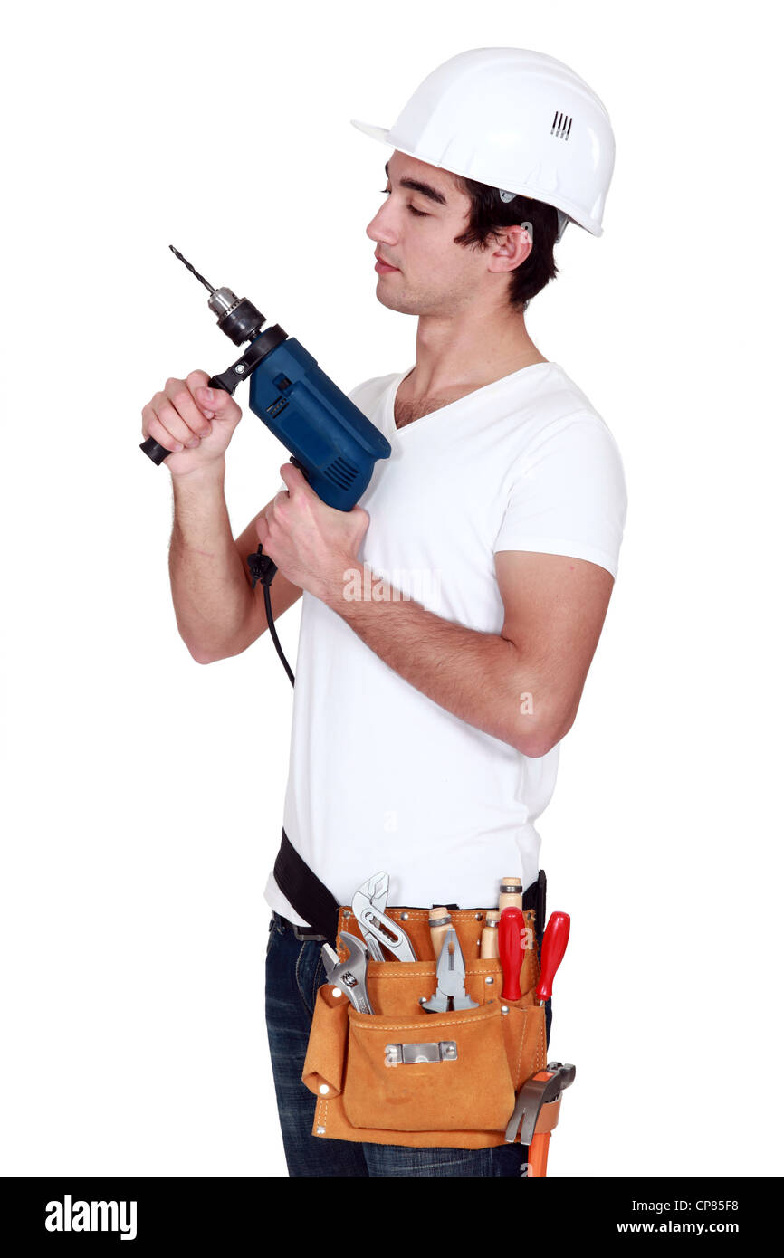 Young man with drill Stock Photo - Alamy