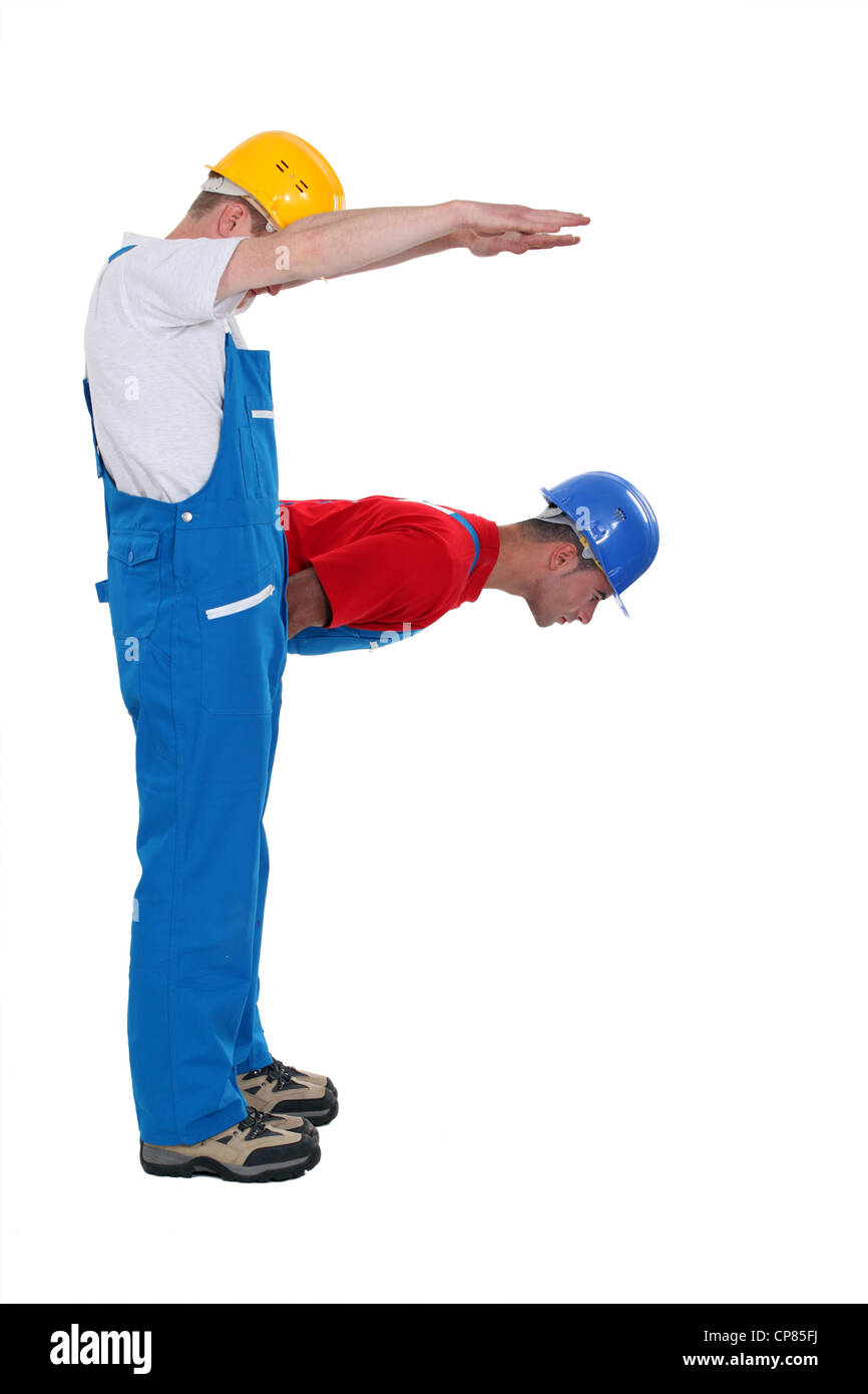 Tradesmen forming the letter F Stock Photo - Alamy
