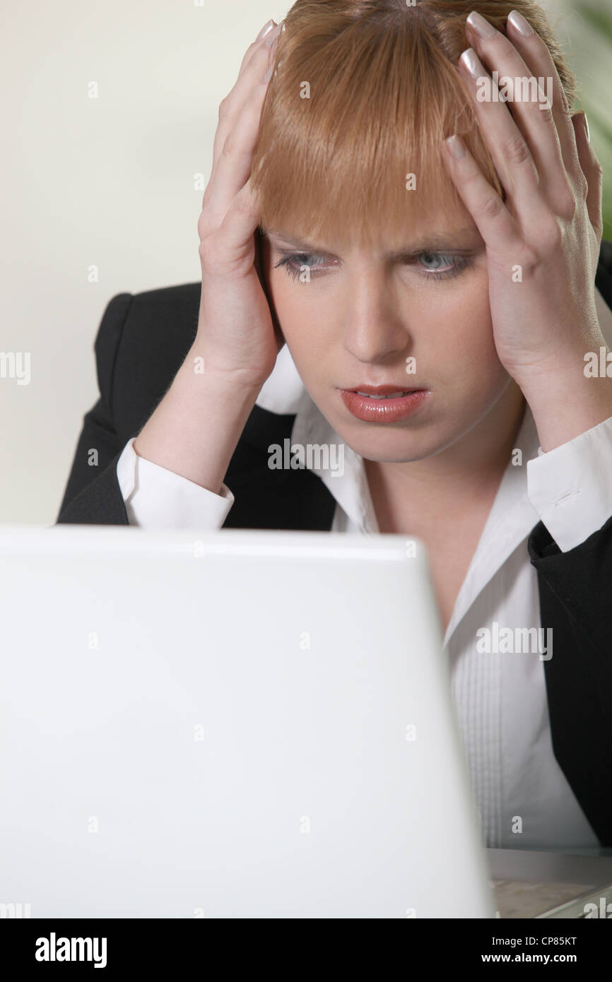 Woman having problems with computer Stock Photo - Alamy