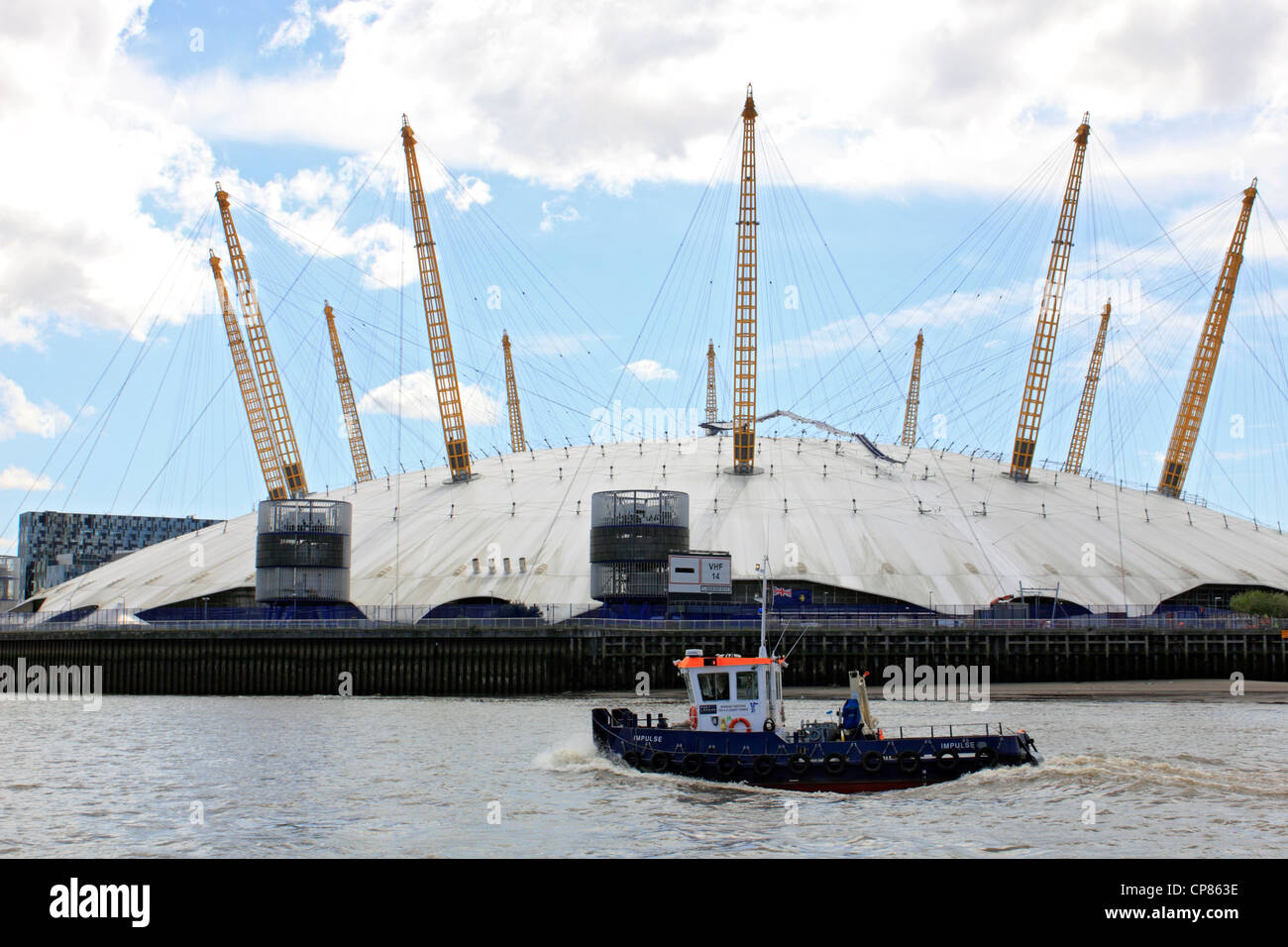 Port authority boat passes the O2 Dome on the River Thames at Greenwich ...