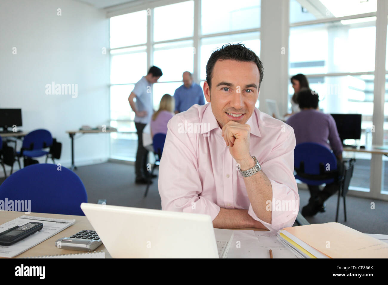 Man working at his desk Stock Photo - Alamy