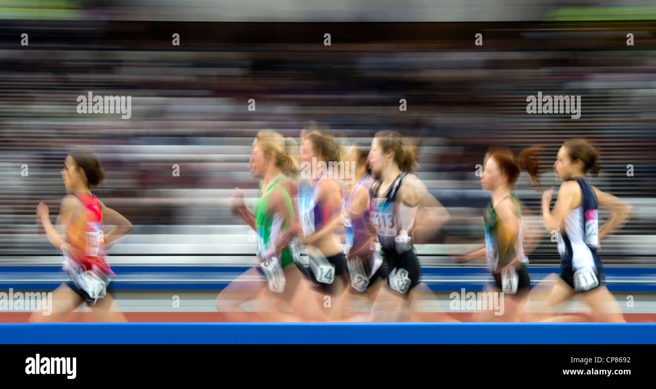 Women run in a long distance athletics track race Stock Photo - Alamy