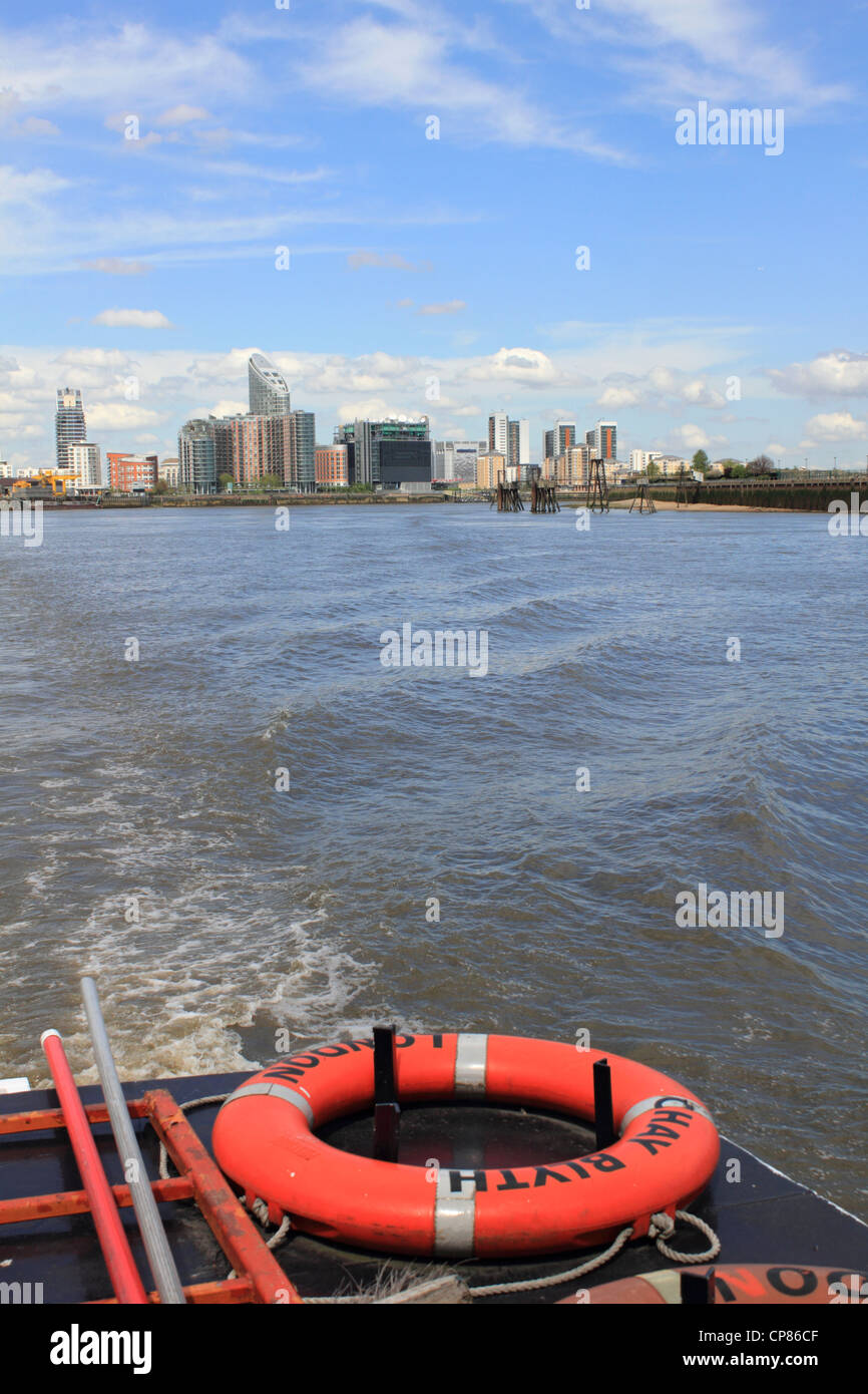 Canary Wharf from Chay Blythe ferry on the River Thames London England ...