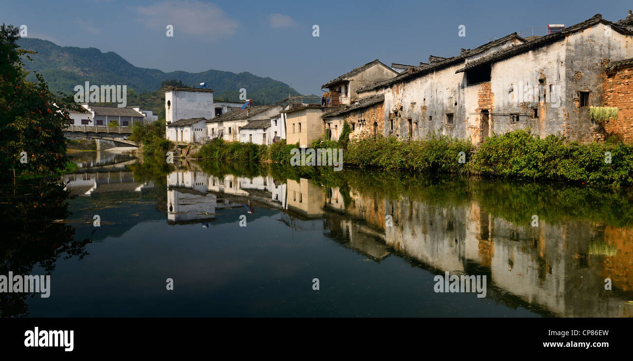 Panorama of Hui style houses reflected in the still Longxi river in ...