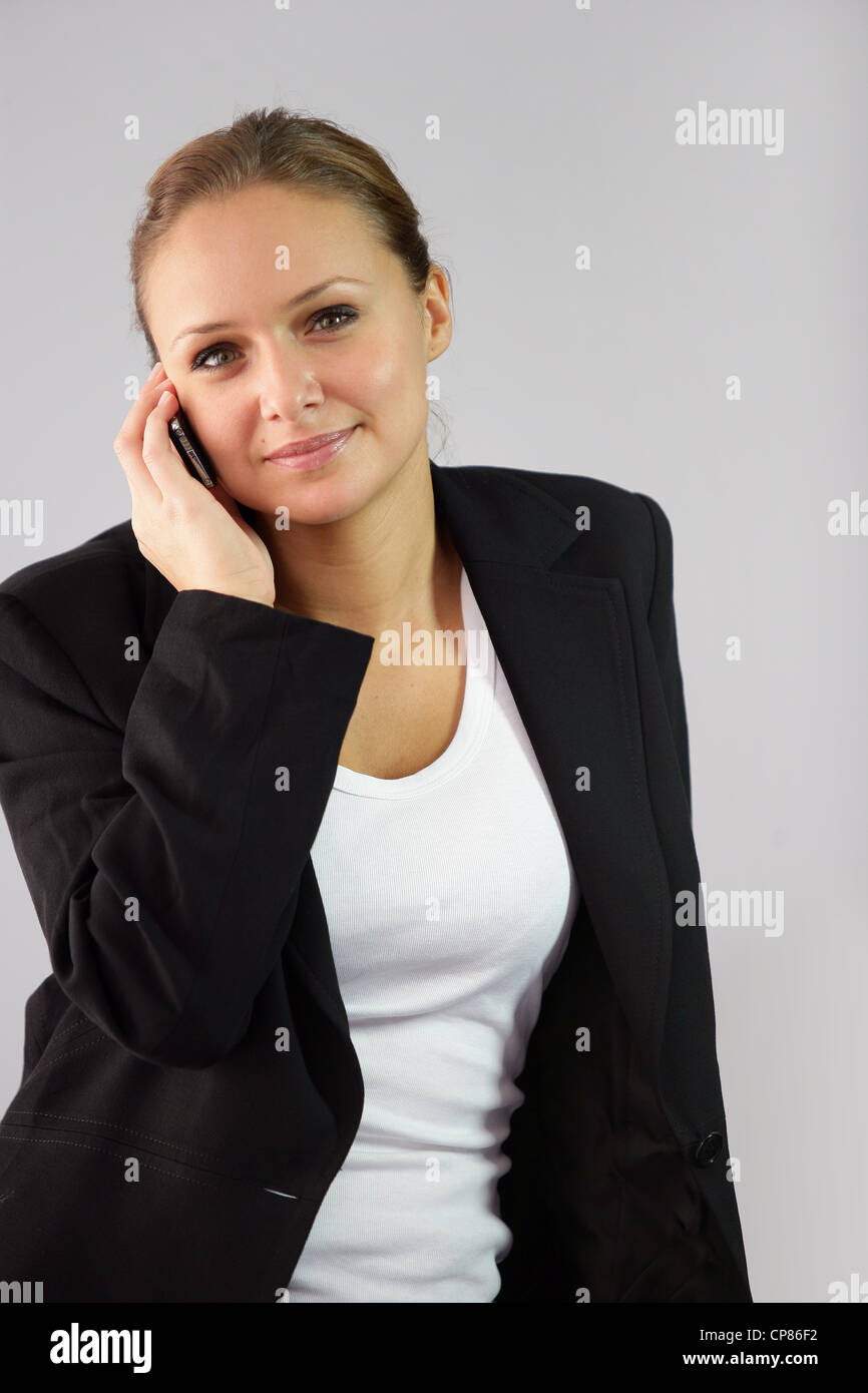 Blond businesswoman making telephone call Stock Photo - Alamy