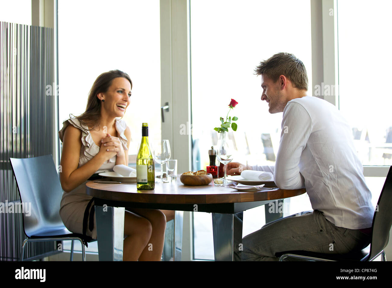 Portrait of a couple enjoying each other's company in a romantic dinner ...