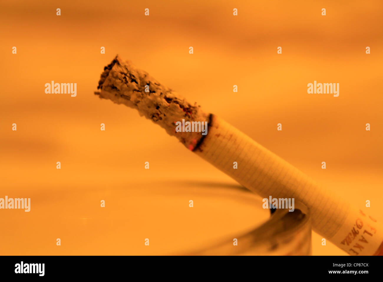 Cigarette burning with ash Stock Photo - Alamy