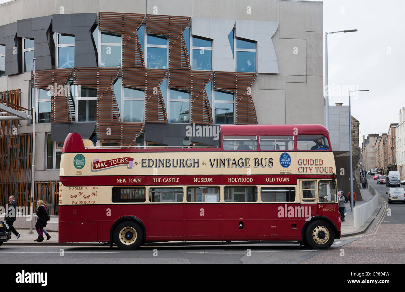 Tourist bus passes Holyrood Parliament Scotland Stock Photo - Alamy