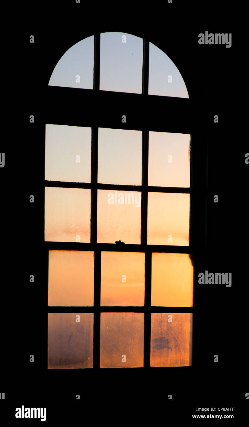 Setting Sun Through a Window Stock Photo - Alamy