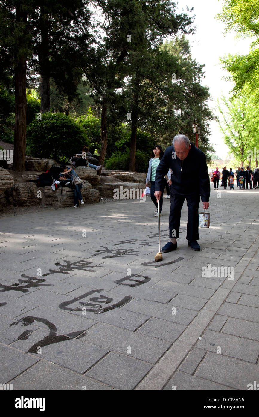 Calligraphy writing at the Jing Shan Park. Beijing, China Stock Photo ...