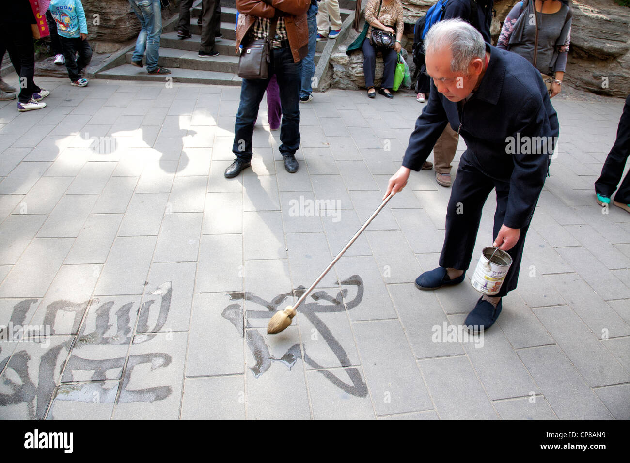 Calligraphy writing at the Jing Shan Park. Beijing, China Stock Photo ...