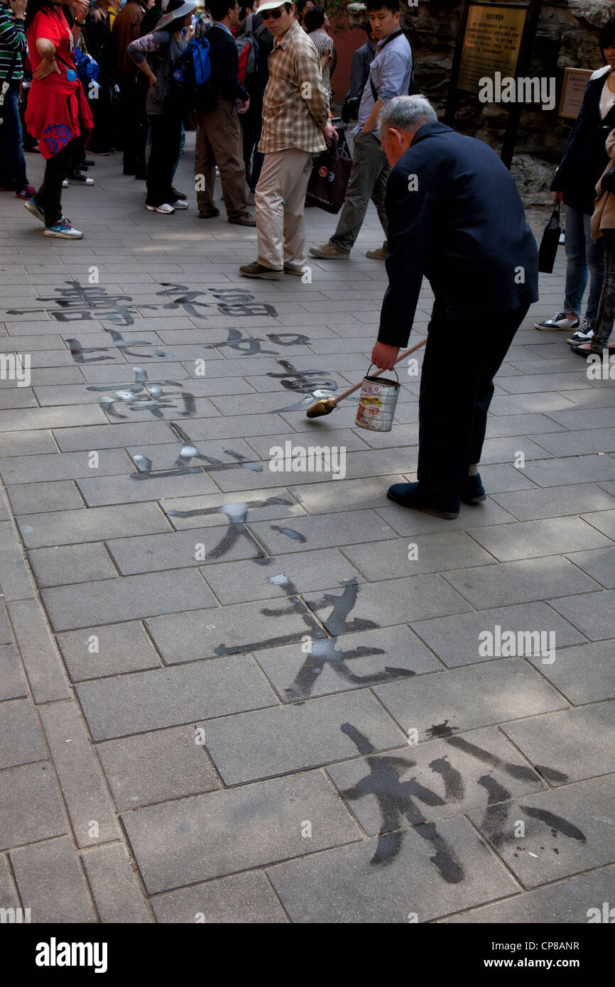Calligraphy writing at the Jing Shan Park. Beijing, China Stock Photo ...