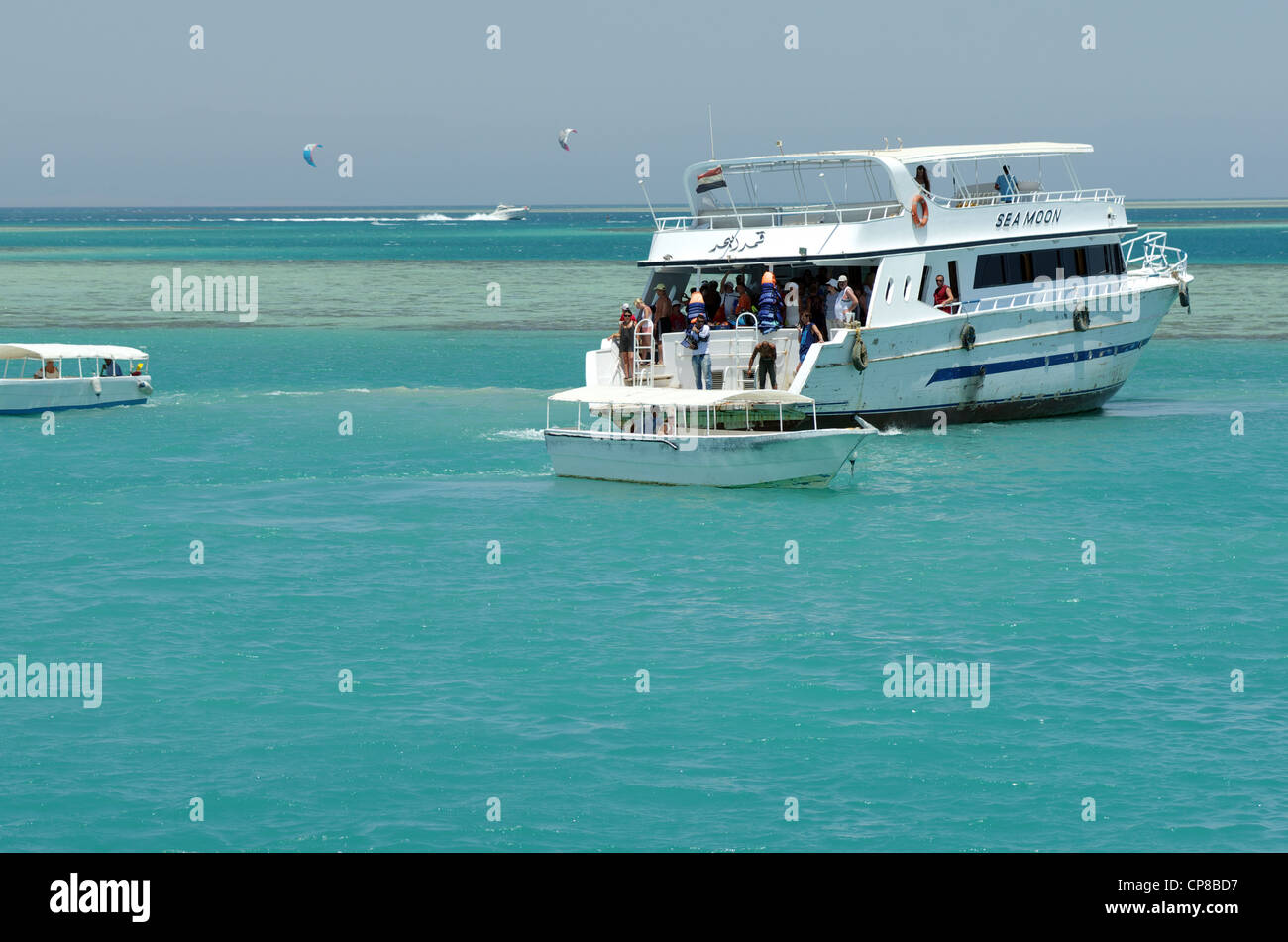 A dive tourist boat for excursions on anchored in the coral reef, El ...