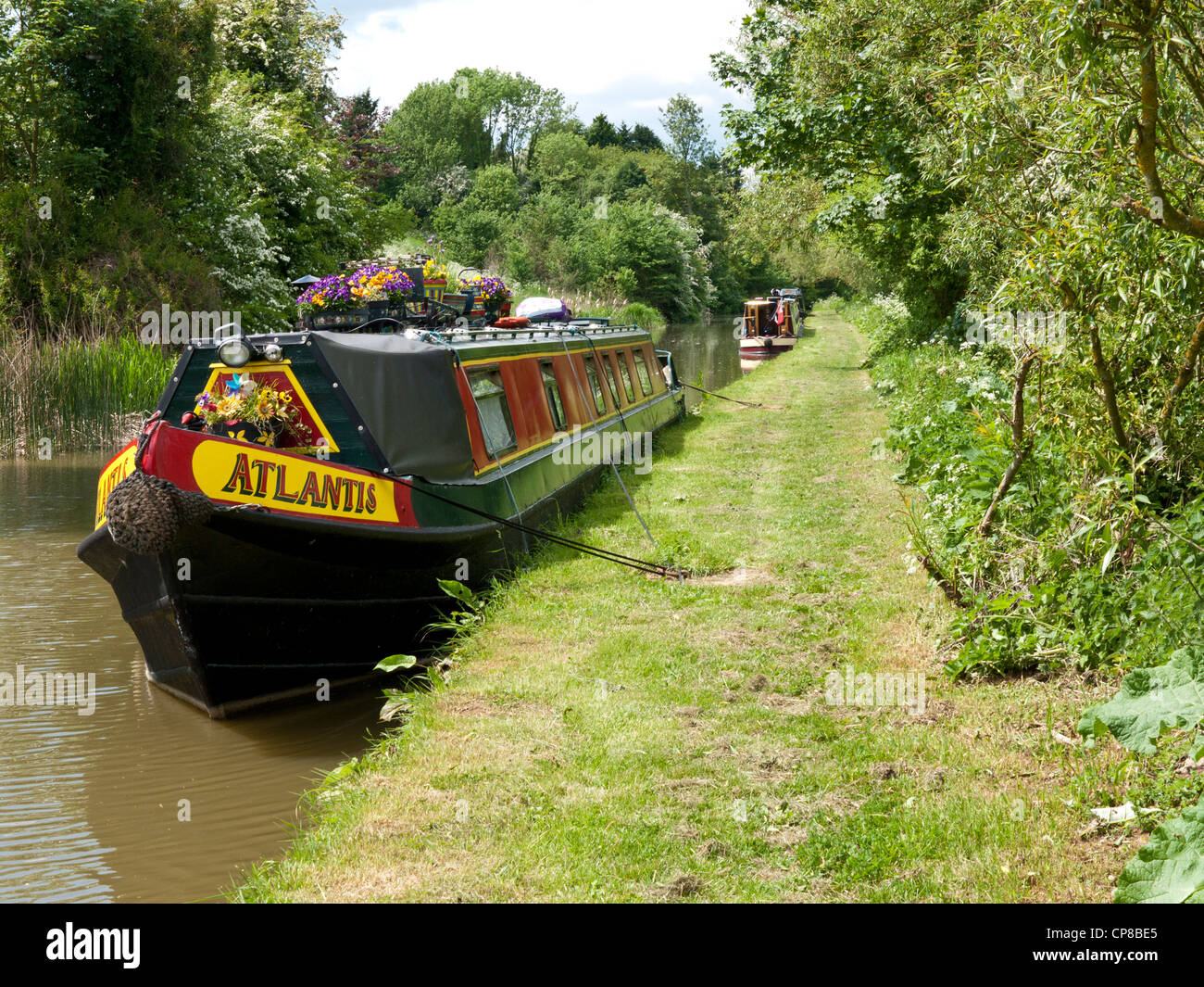 Narrow boat Atlantis moored on the banks of the Oxford Canal near Nell ...