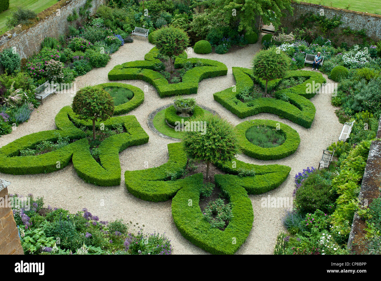 High viewpoint towards the Fleur de Lys gardens of Broughton Castle ...