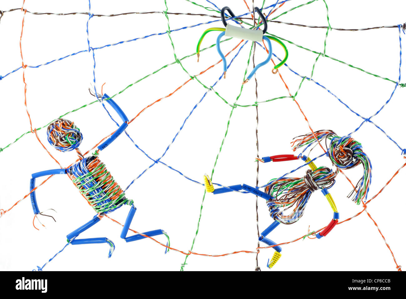 Toy little men and girl were tangled in a network of a toy spider. Toys ...