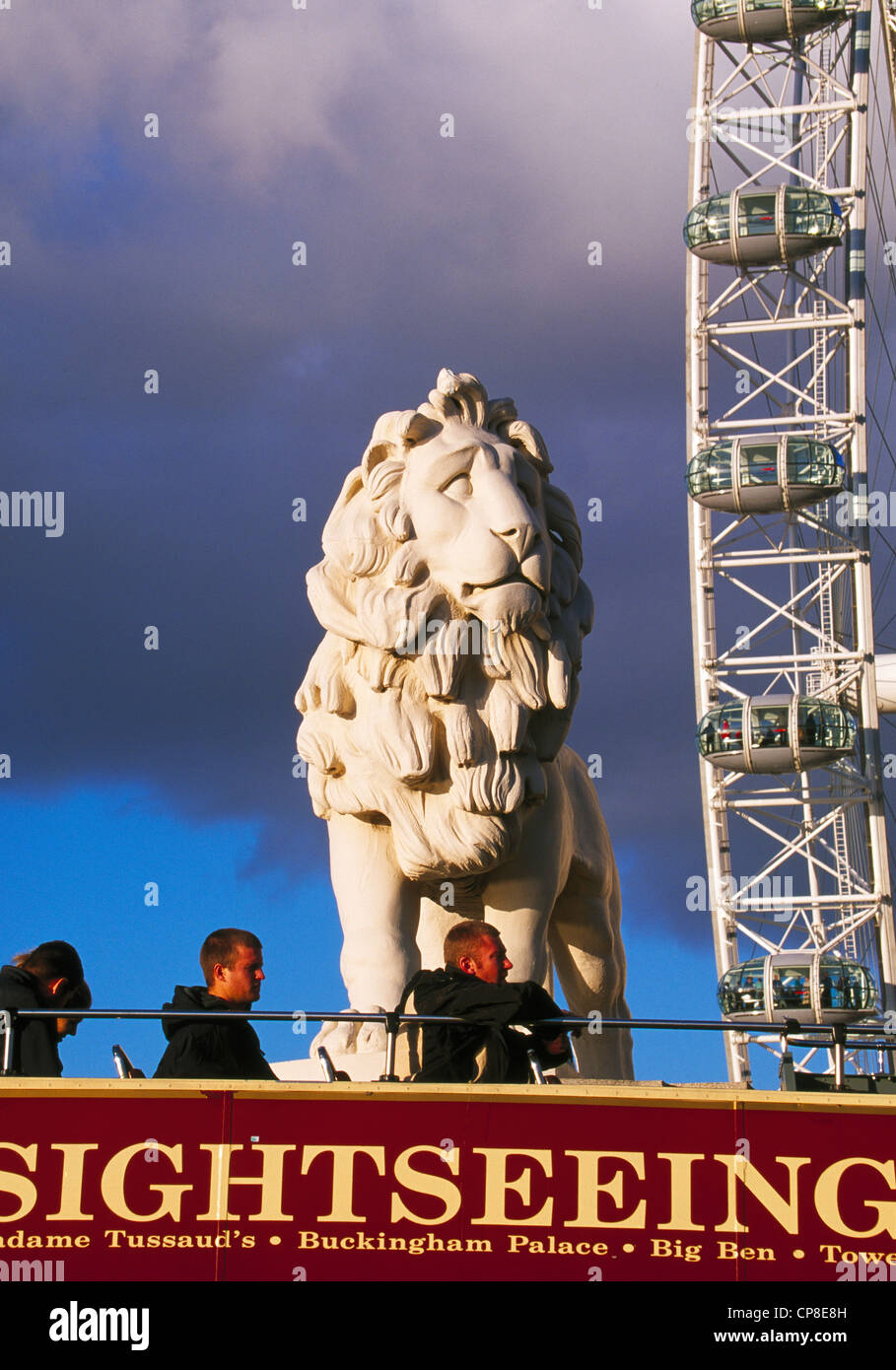 The London Eye, Lion statue and sightseeing bus on Westminster Bridge ...