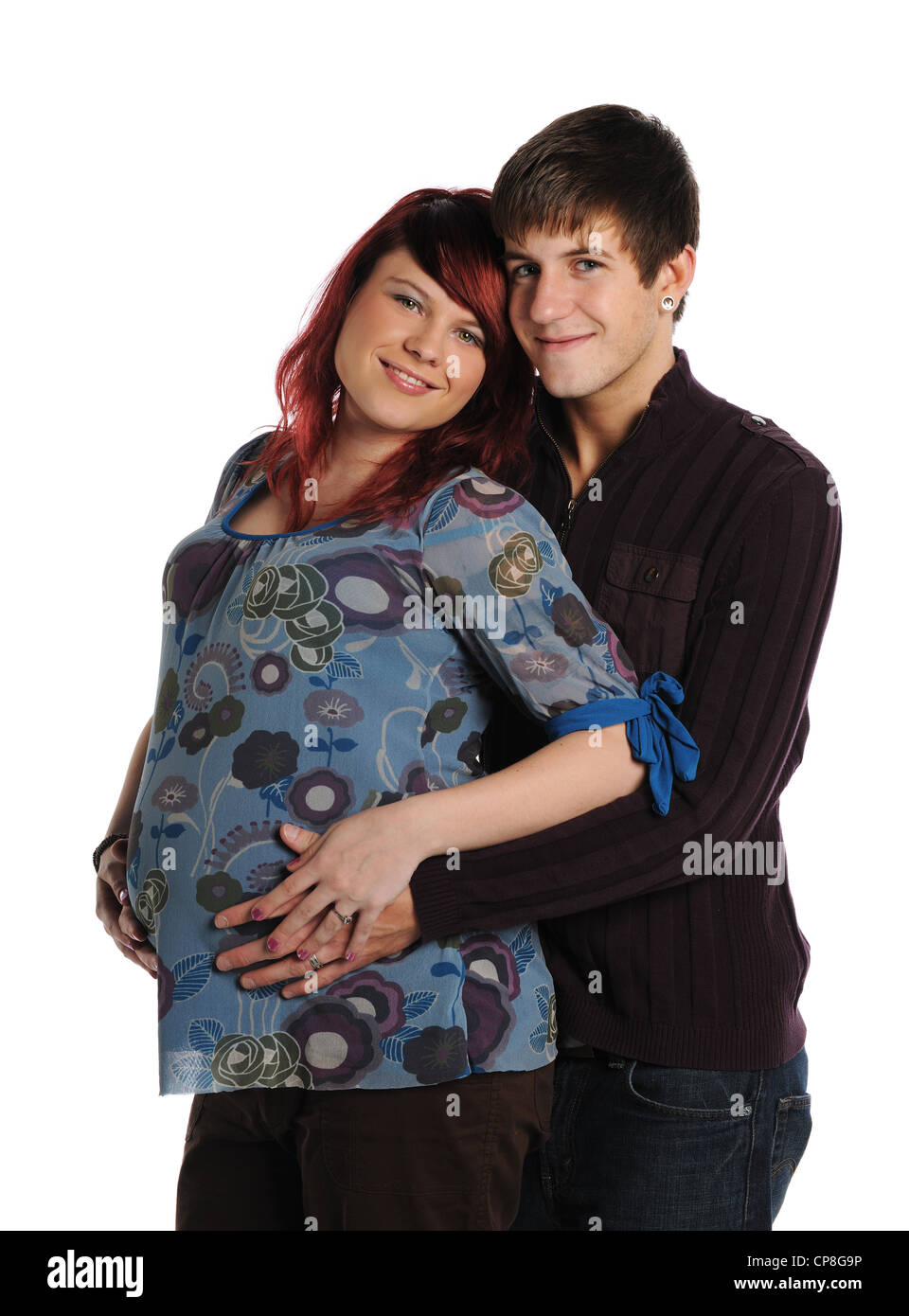 Young Couple Expecting hugging and smiling isolated on a white ...
