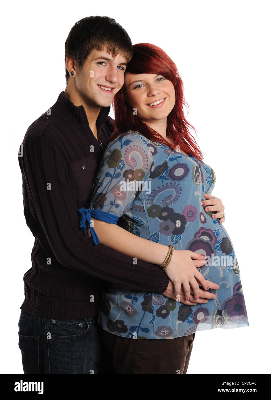 Young Couple Expecting hugging and smiling isolated on a white ...