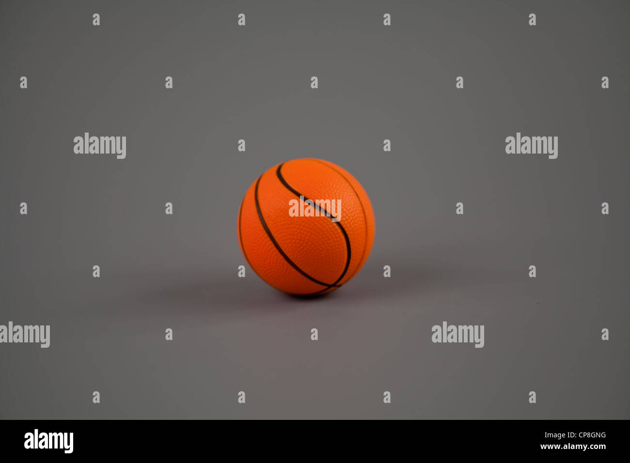 Orange basketball isolated on the grey Stock Photo - Alamy