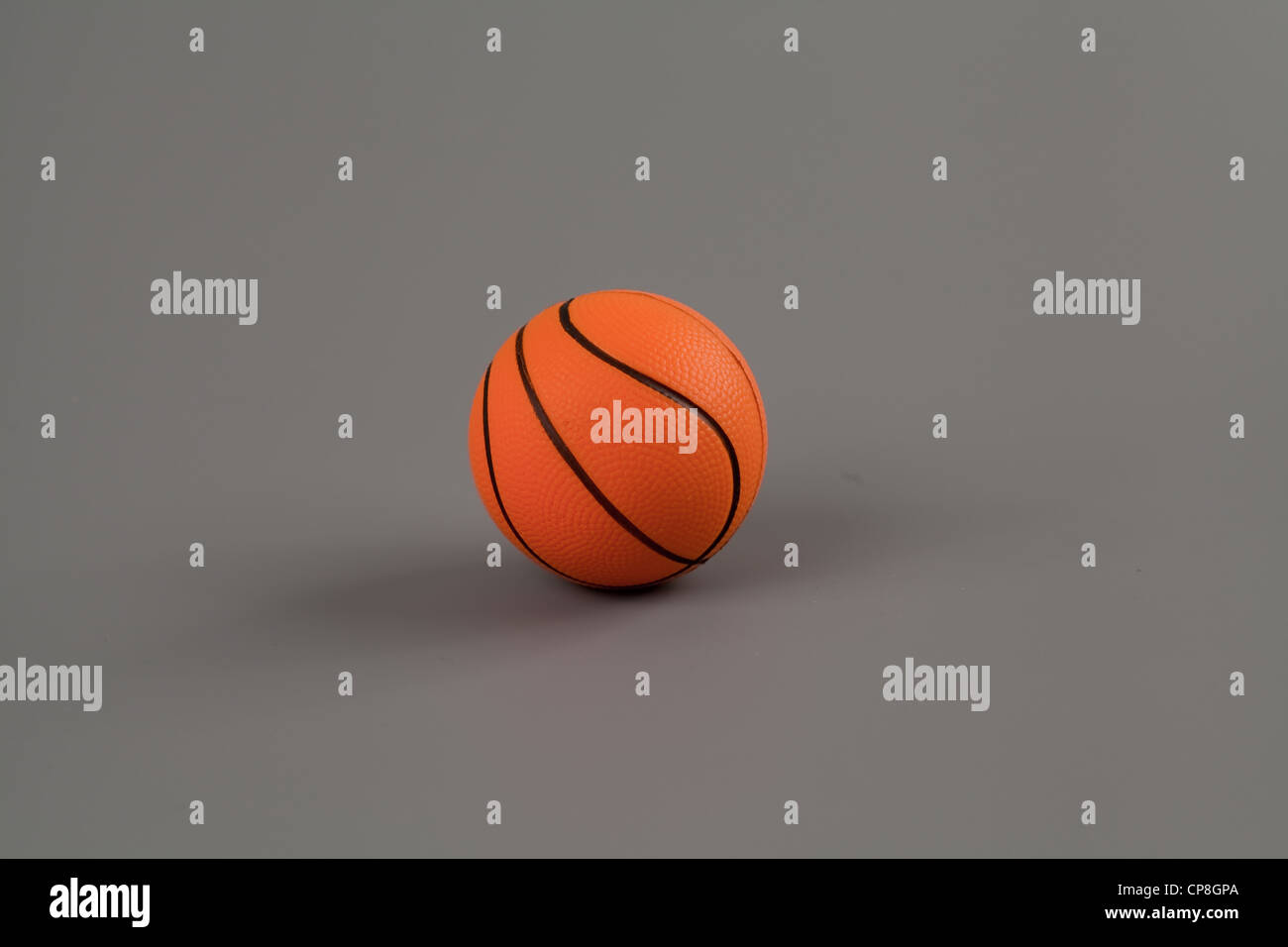 Orange basketball isolated on the grey Stock Photo - Alamy