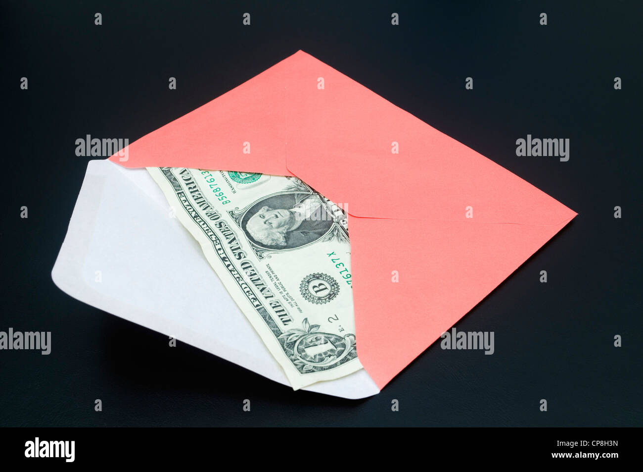 one dollar bill in red envelope Stock Photo - Alamy