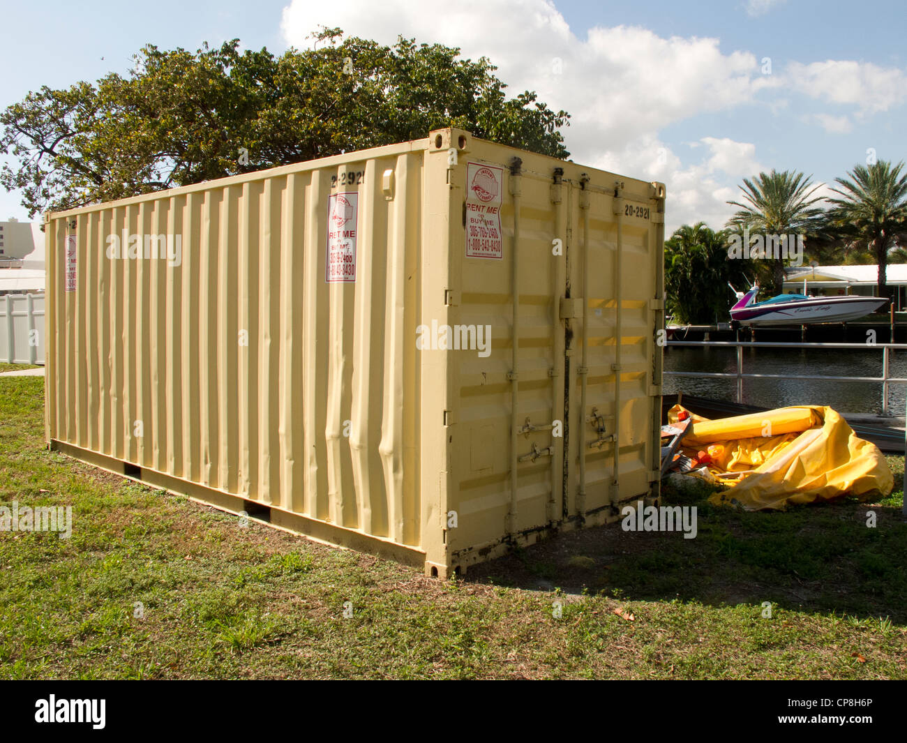 Yellow trash dumpster Stock Photo - Alamy