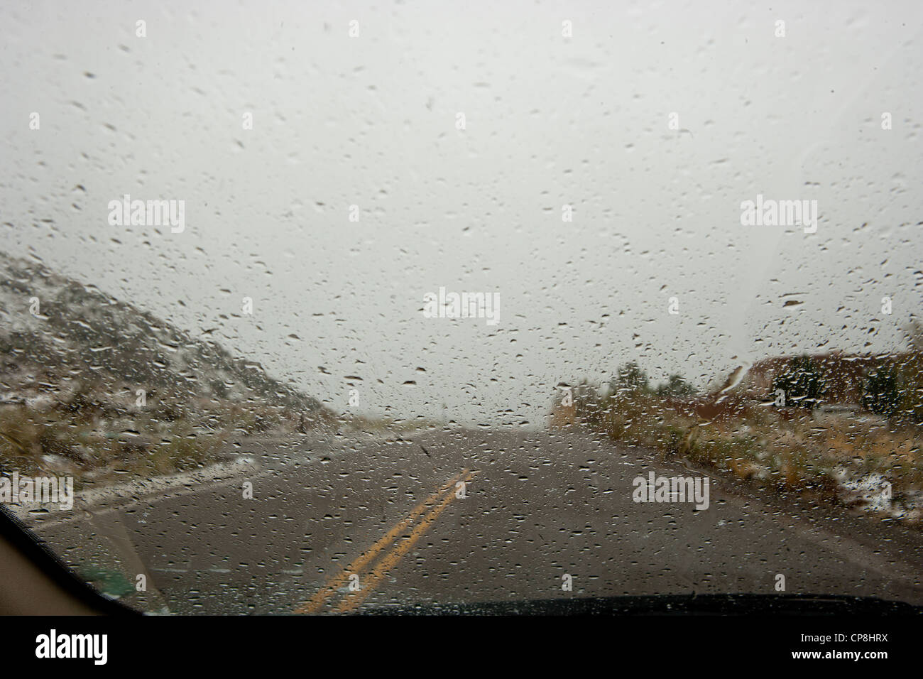 Rain drops on car windshield in a storm Stock Photo - Alamy