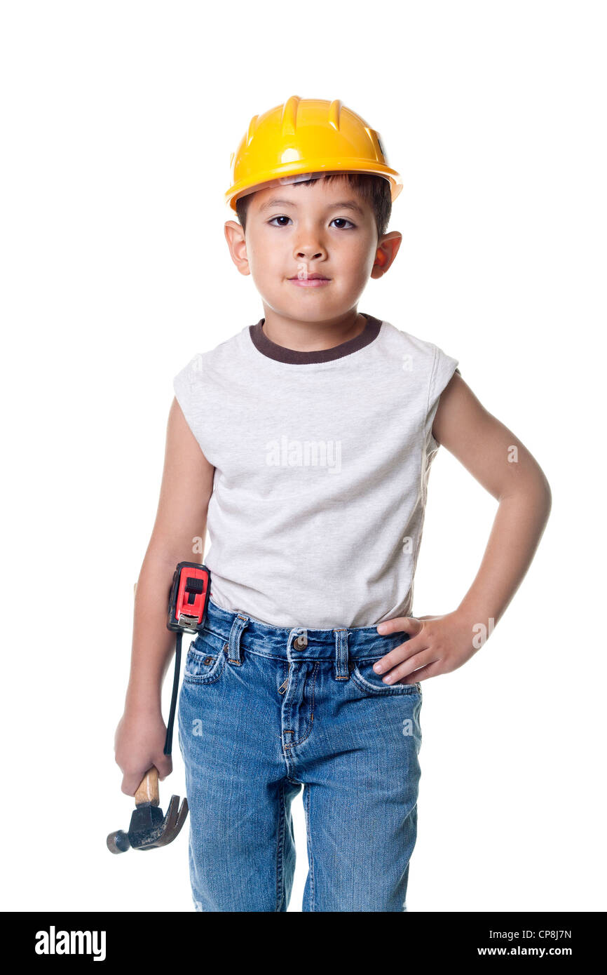 A young boy dresses up in construction cloths with some tools Stock ...