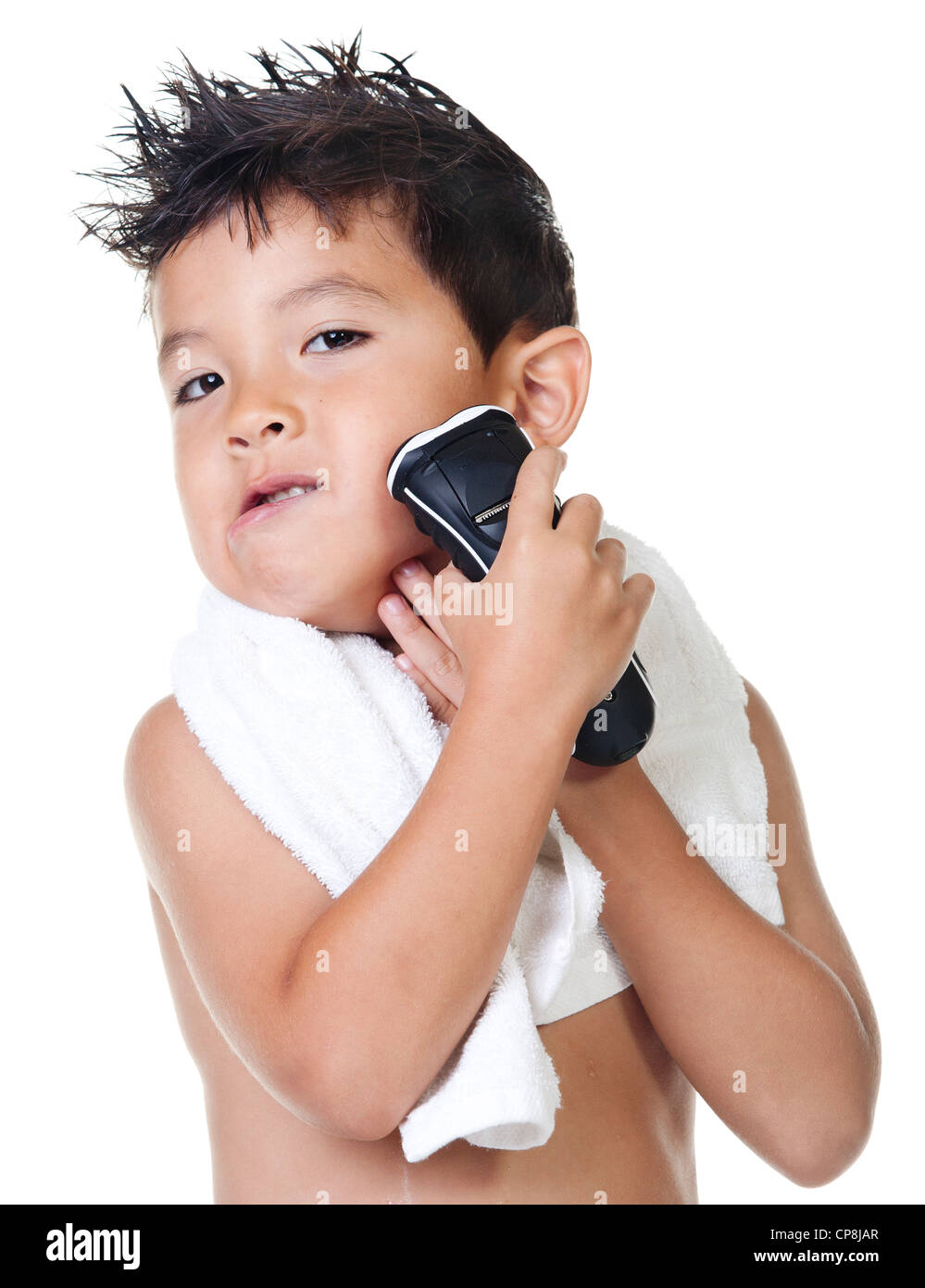 A young boy has fun pretending to shave with an electric razor Stock ...