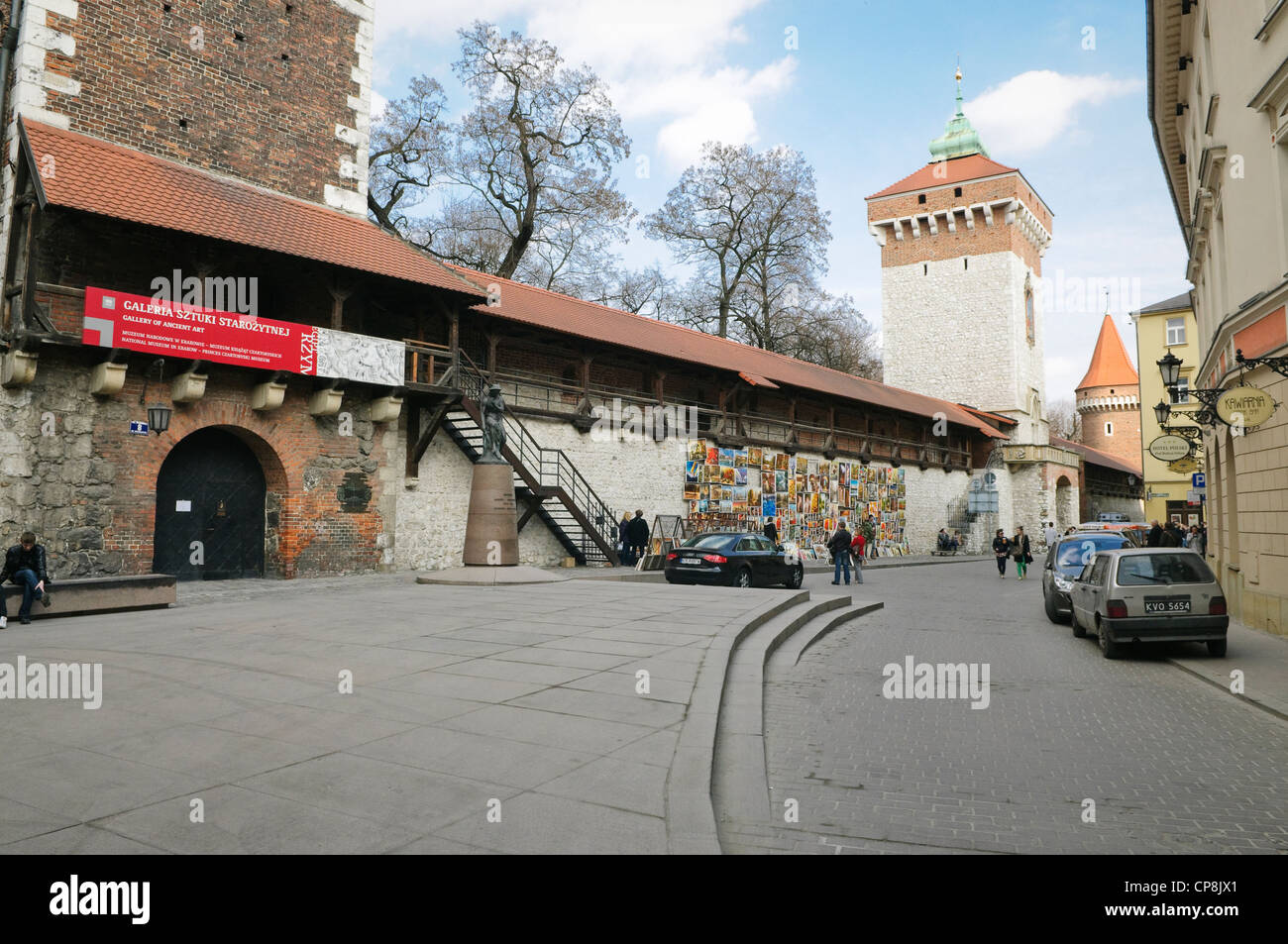 Part of city wall with Florianska Gate and paintings for sale, Krakow ...