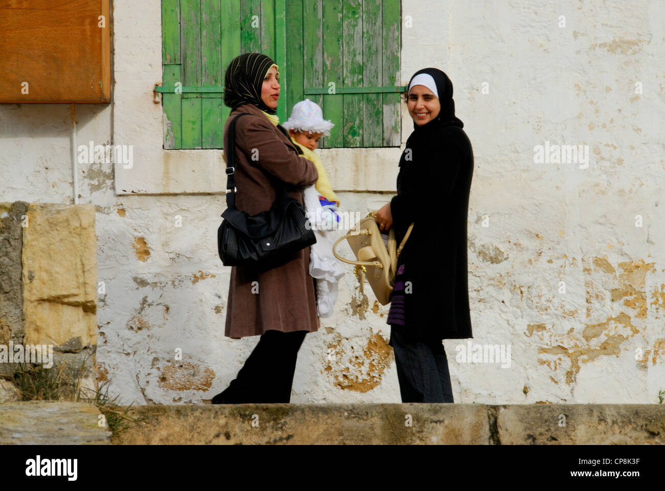 Two Cypriot women chatting. Kato Pafos / Paphos, Cyprus Stock Photo - Alamy