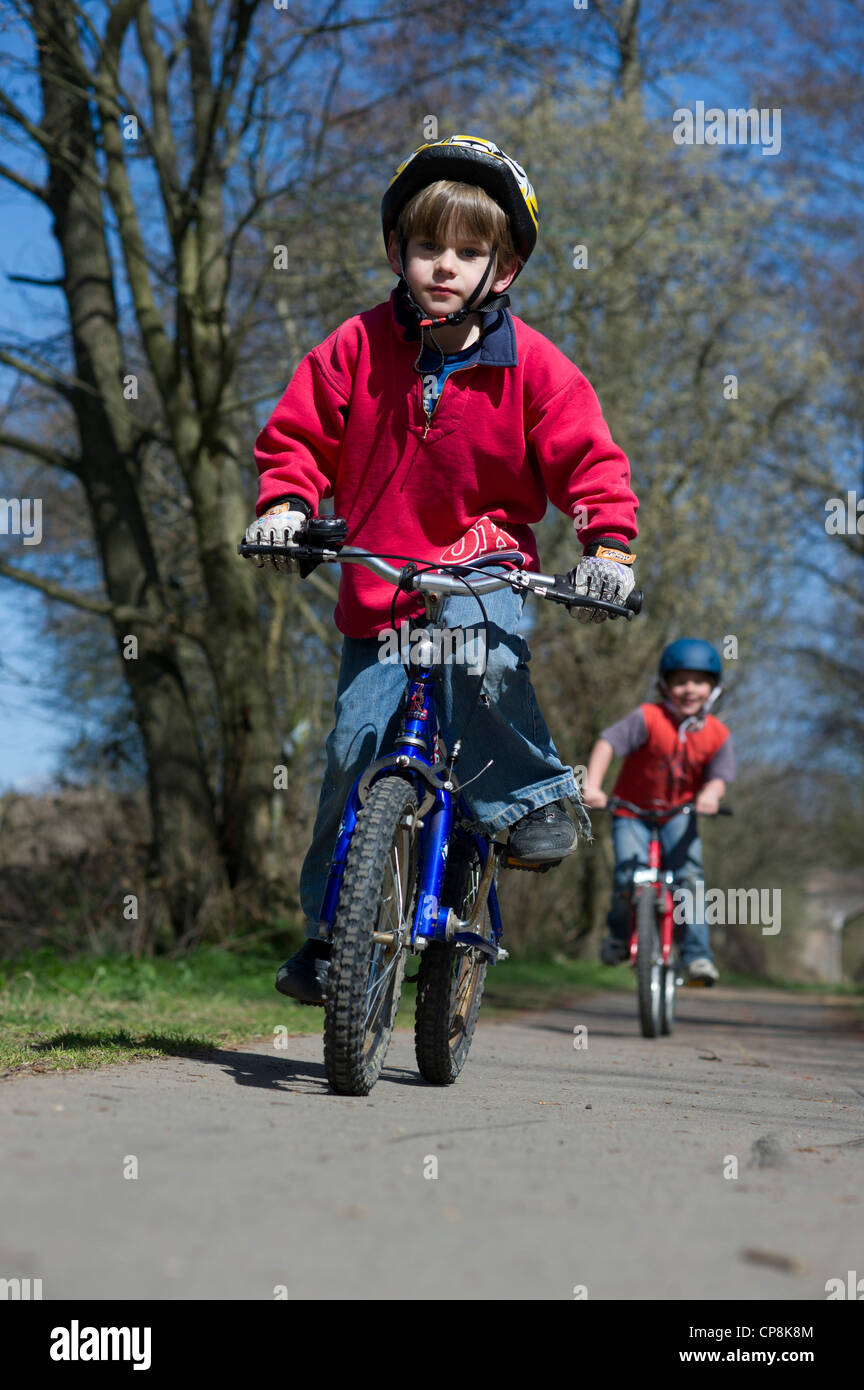Children cycling on bike trails Stock Photo - Alamy