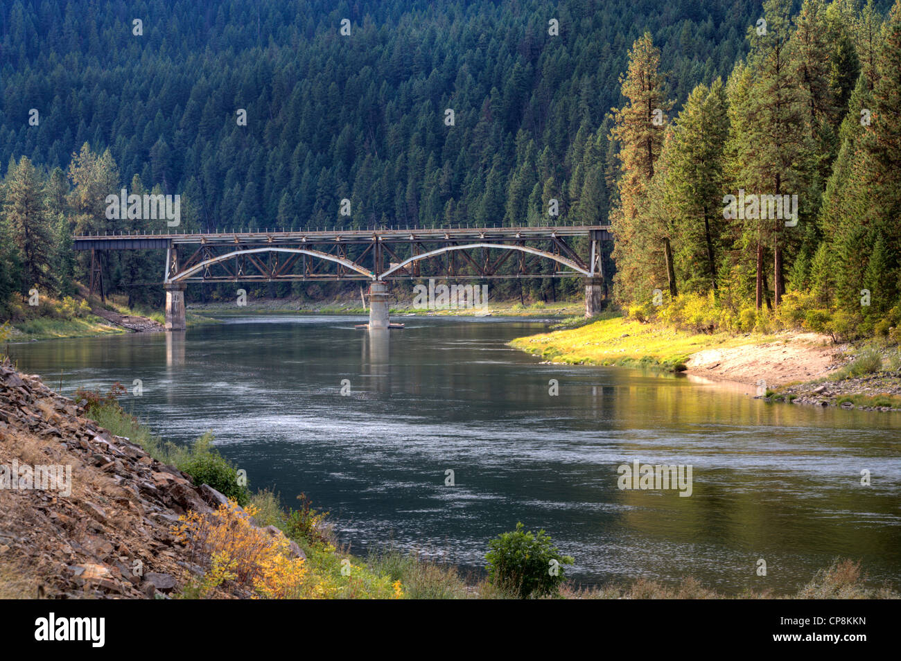A bridge in the distance spans across the Flathead river in Montana ...