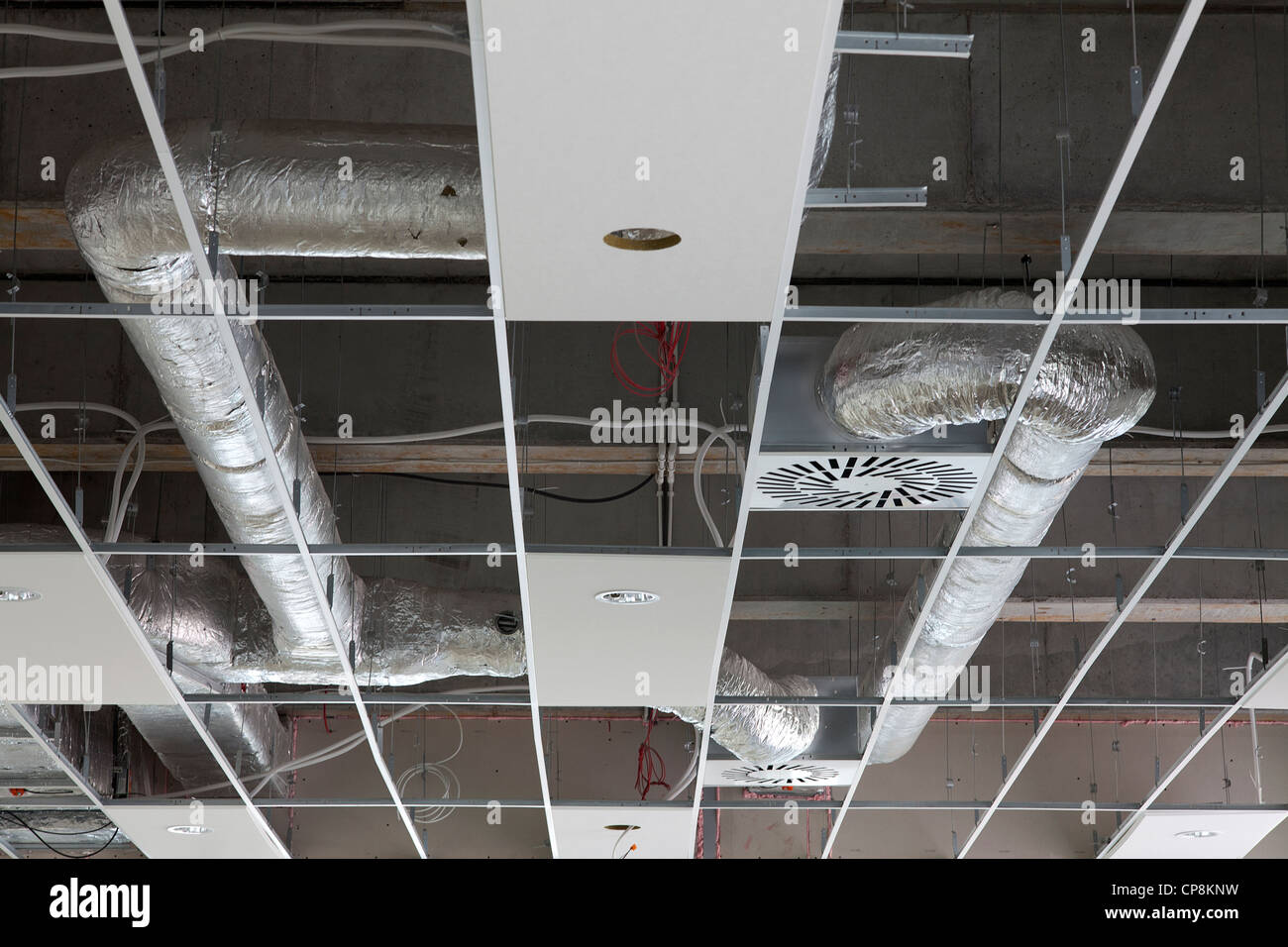 ceiling construction and air conditioning pipes in unfinished building ...