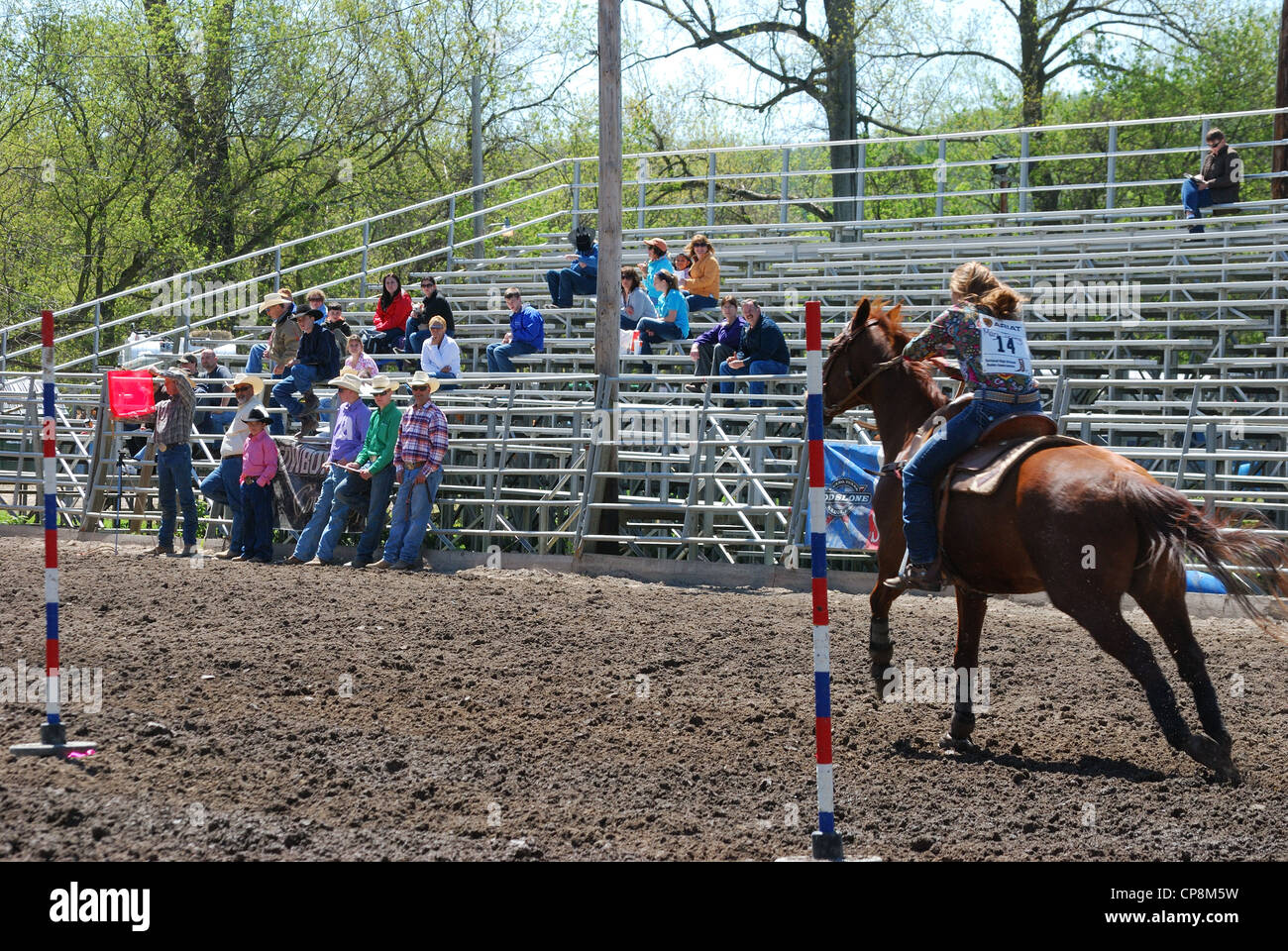 Horse and American teenage rider compete in pole racing Stock Photo - Alamy