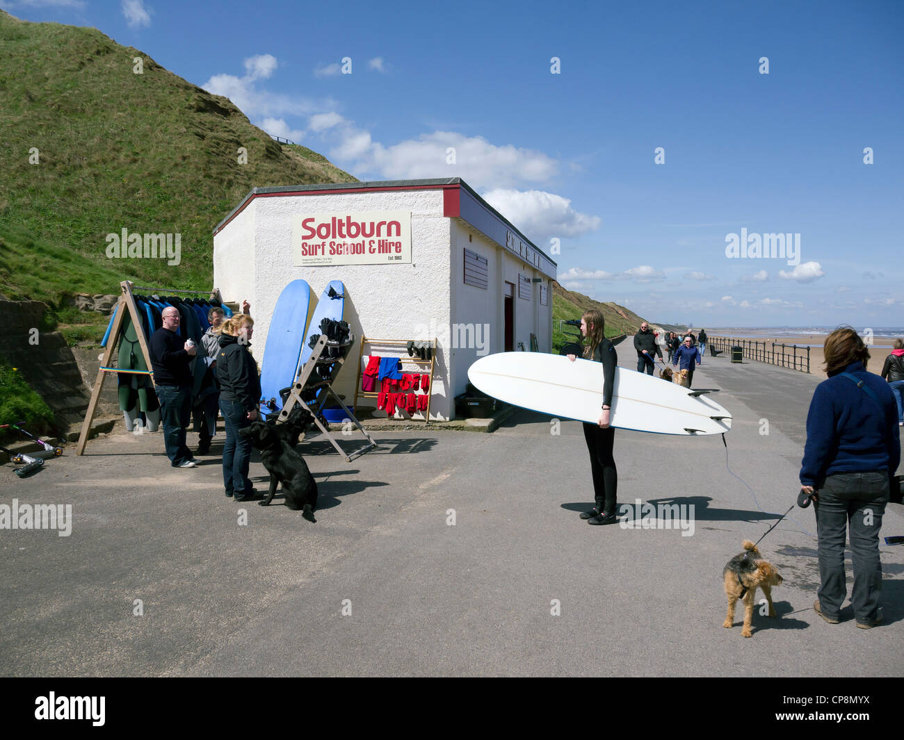 Surf people talking outside the Surf Shop on the busy promenade at ...