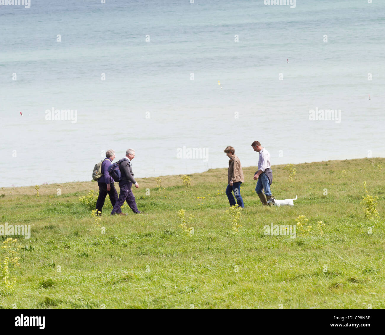 Walkers enjoying a stroll along the "North Norfolk" "Coastal Path" East ...