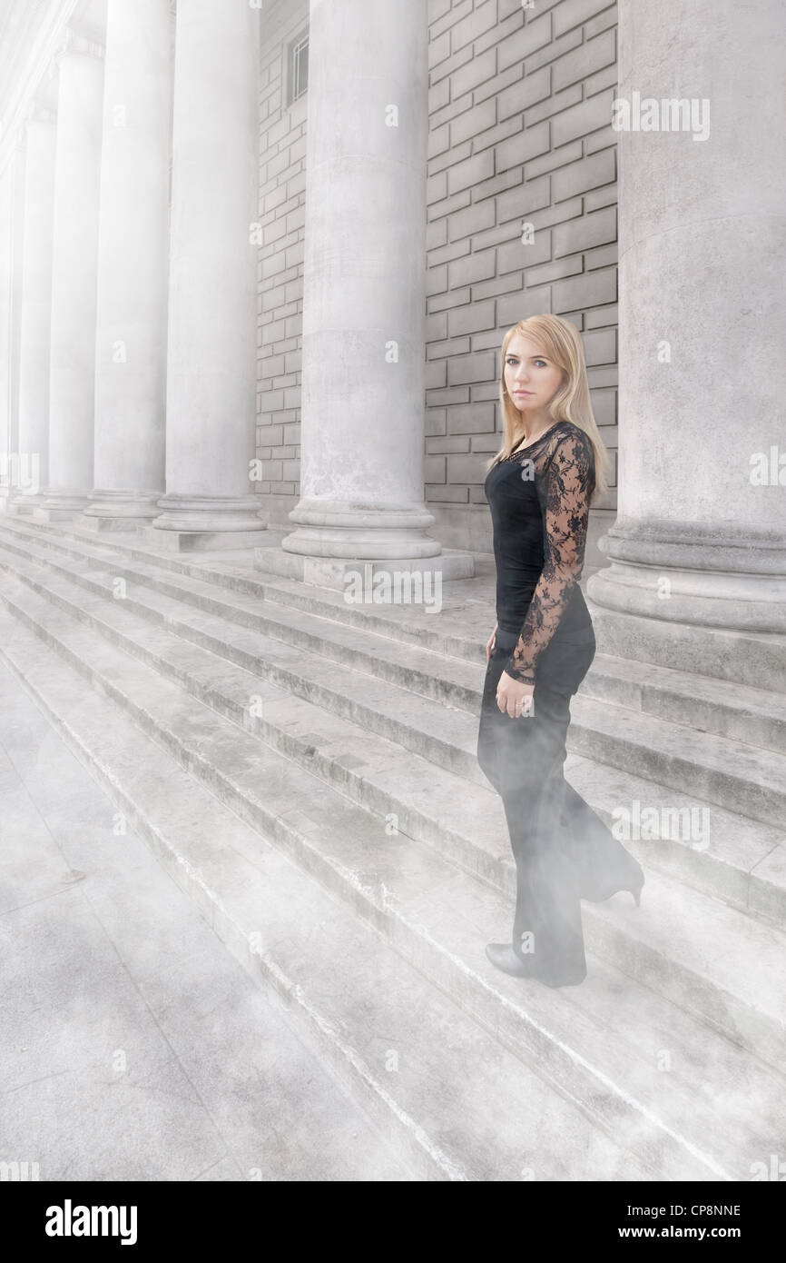 Beautiful woman in the mist Stock Photo - Alamy