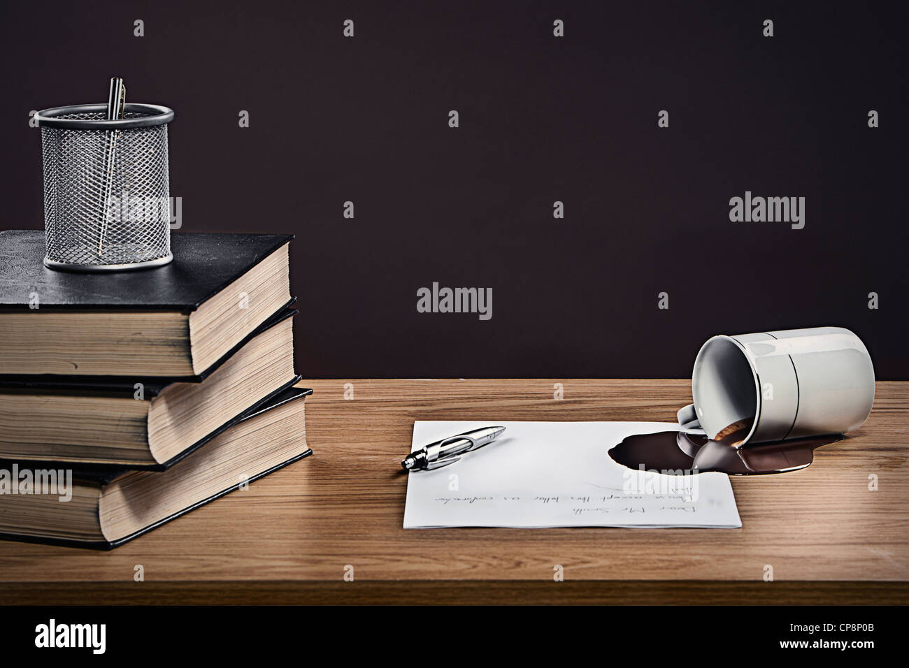 Coffee spilled over letter on desk Stock Photo - Alamy
