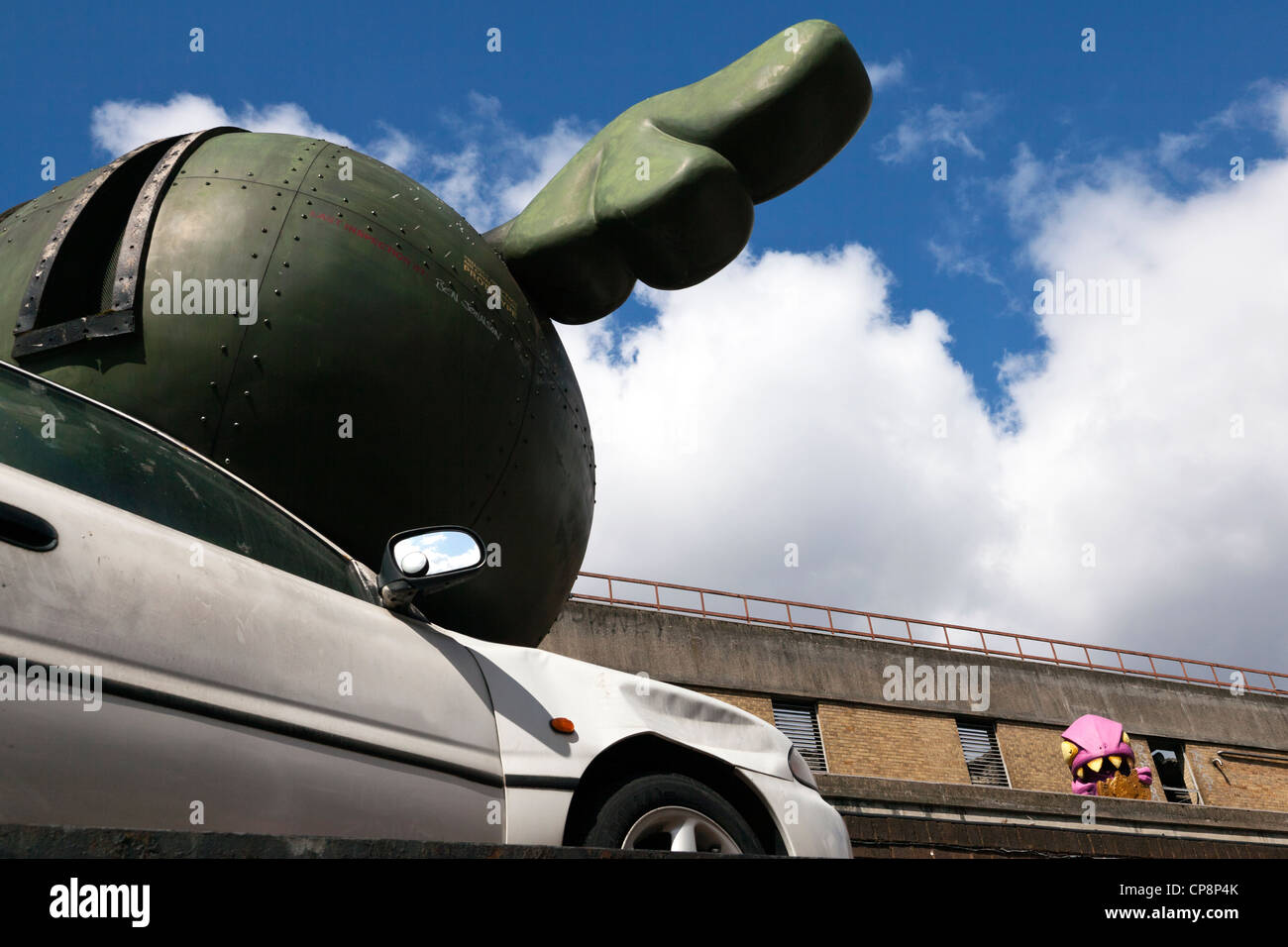 Car crushed by a winged bomb by D*Face, Dray Walk, Brick Lane, London ...