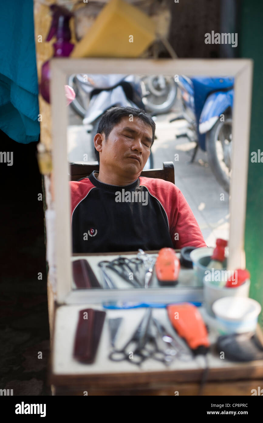 Street Barber asleep Stock Photo - Alamy