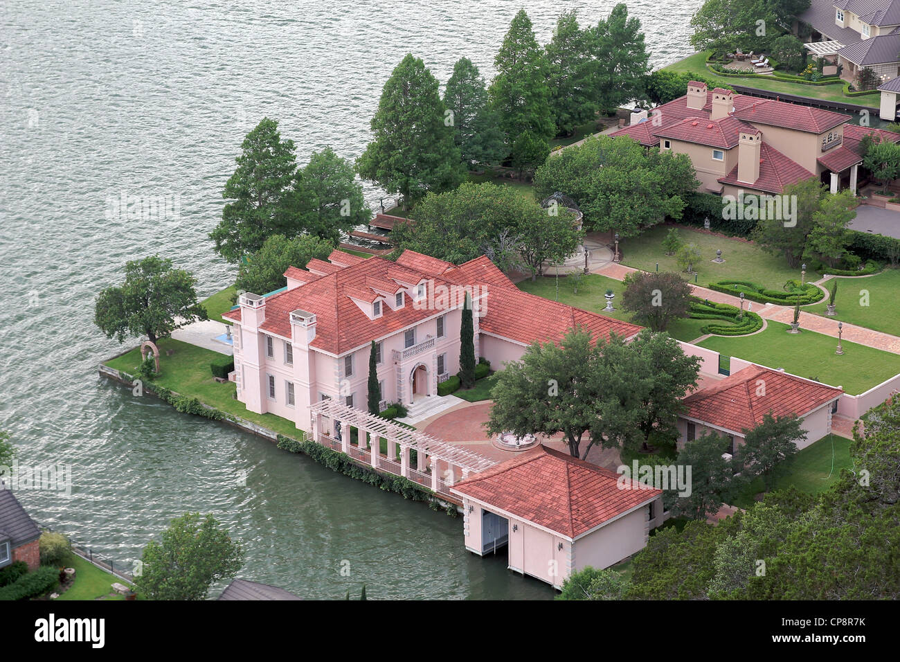 A pink mansion on the Colorado River seen from above, in Austin, Texas ...
