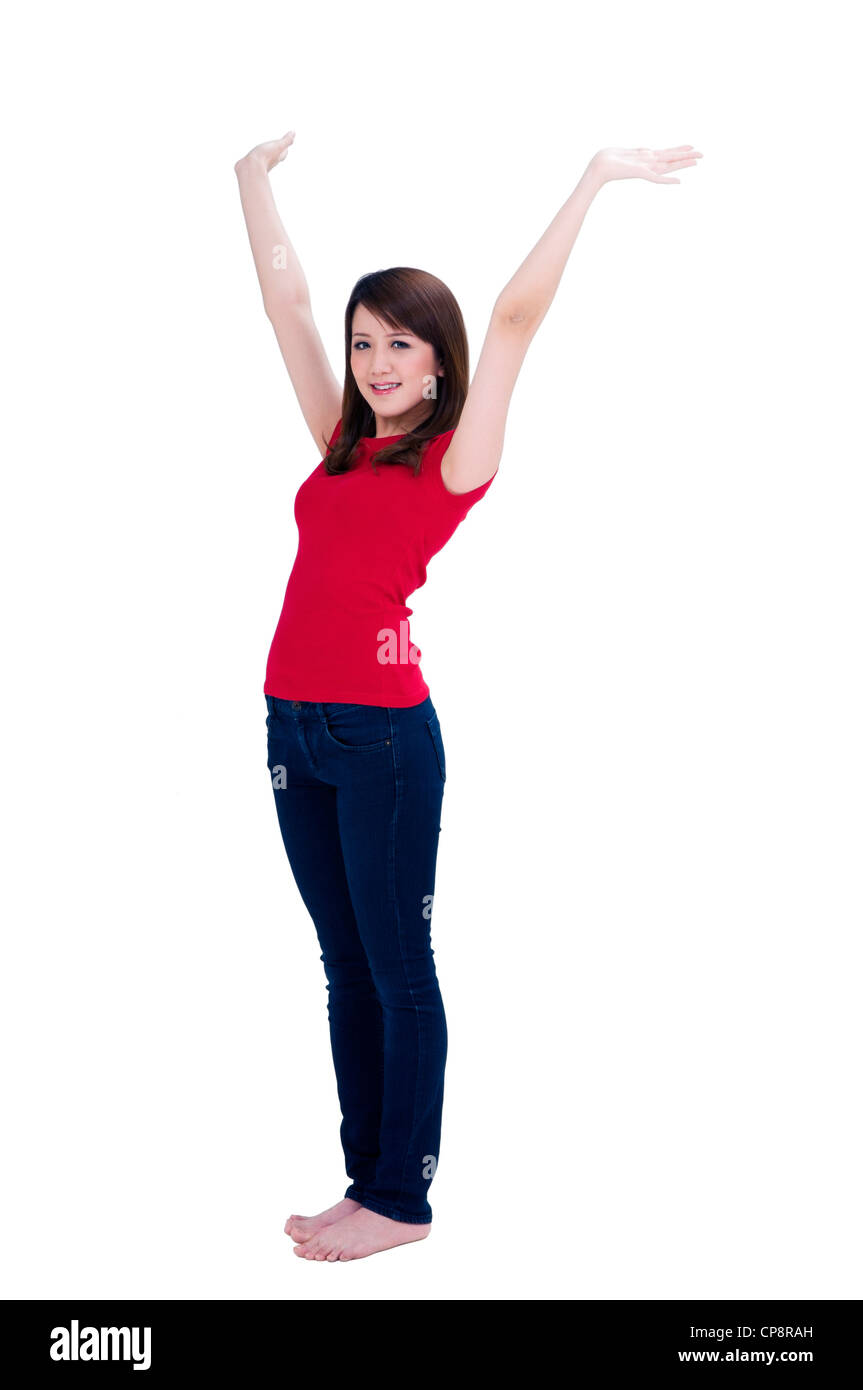 Happy young woman with her arms raised Stock Photo - Alamy