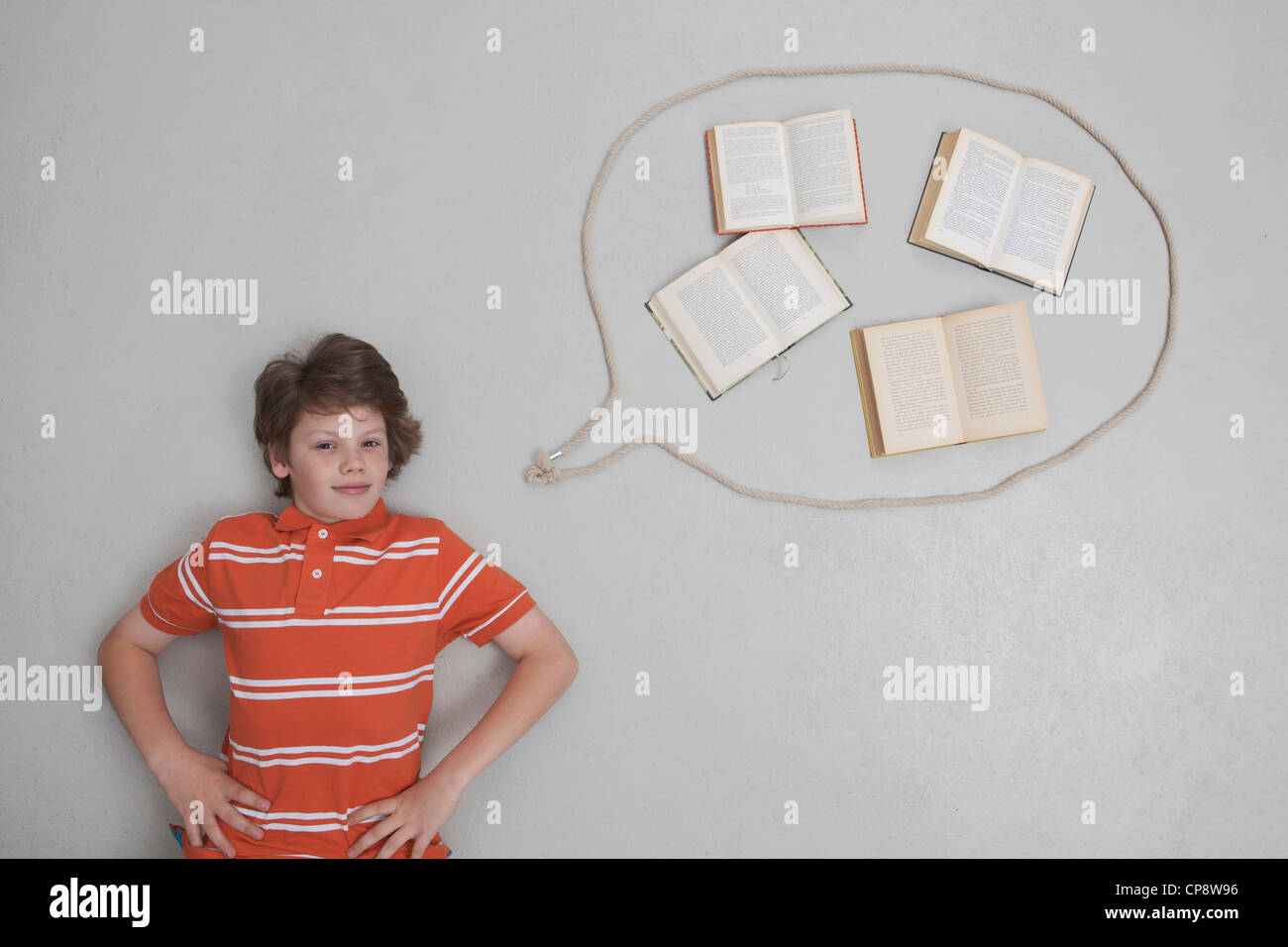 Boy with books in speech bubble, portrait Stock Photo - Alamy